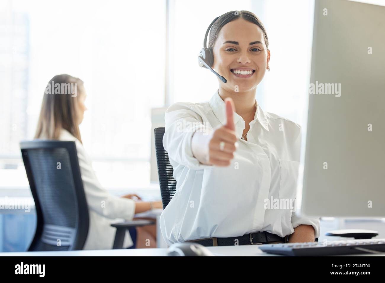 Delivering exceptional service. a young woman showing thumbs up while ...