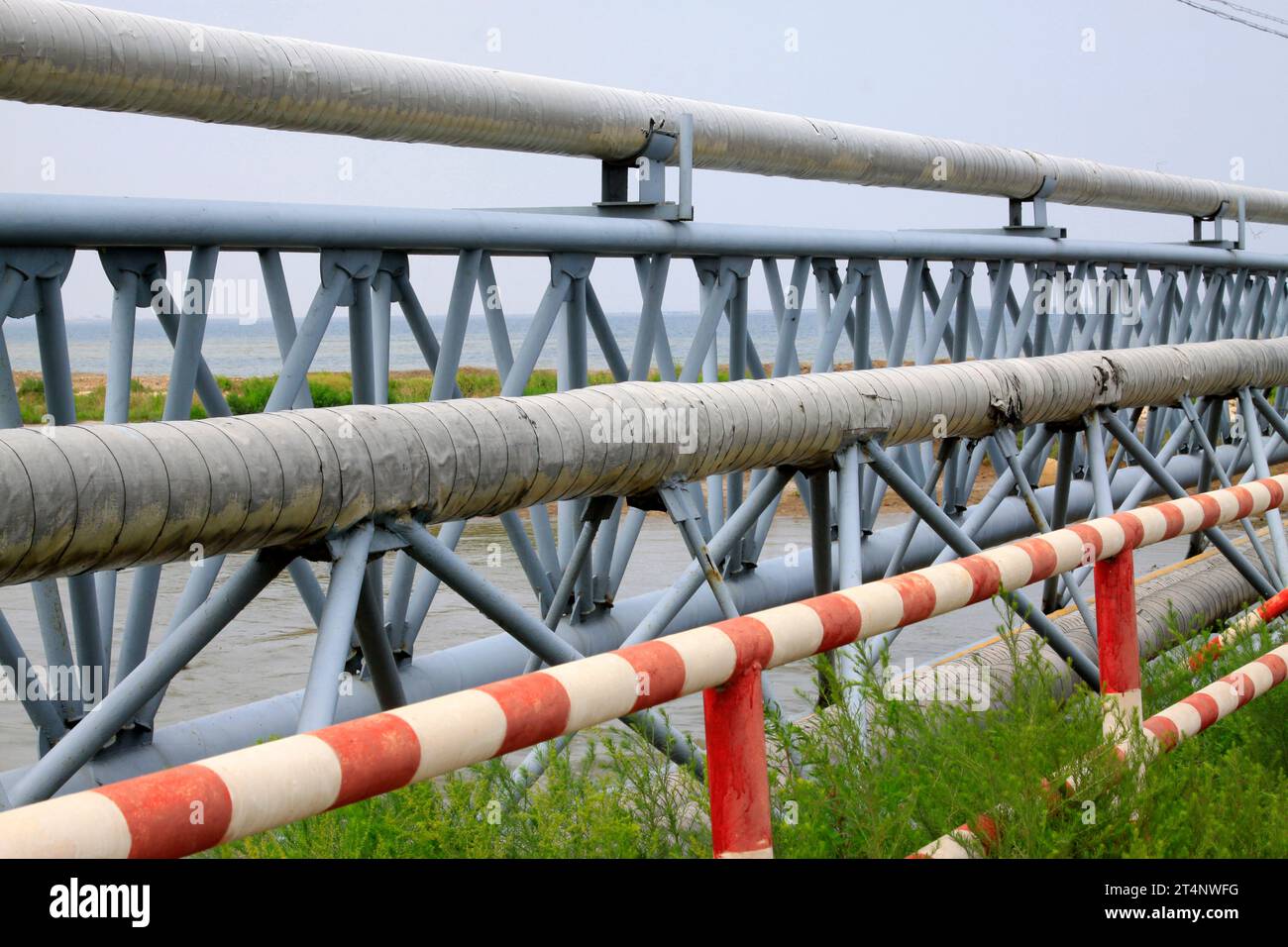 Oil pipelines and traffic signs, closeup of photo Stock Photo - Alamy