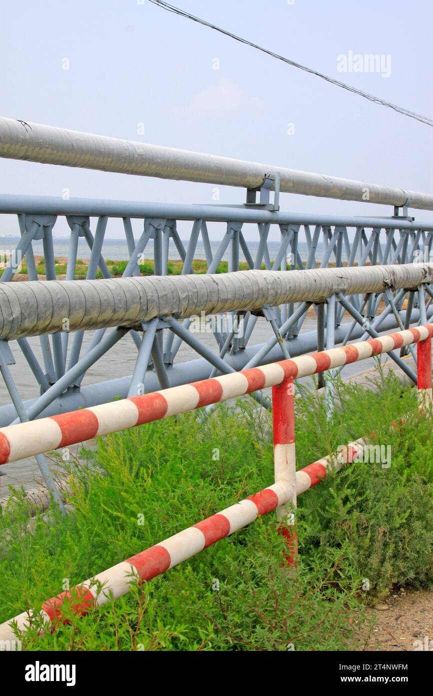 Oil pipelines and traffic signs, closeup of photo Stock Photo - Alamy