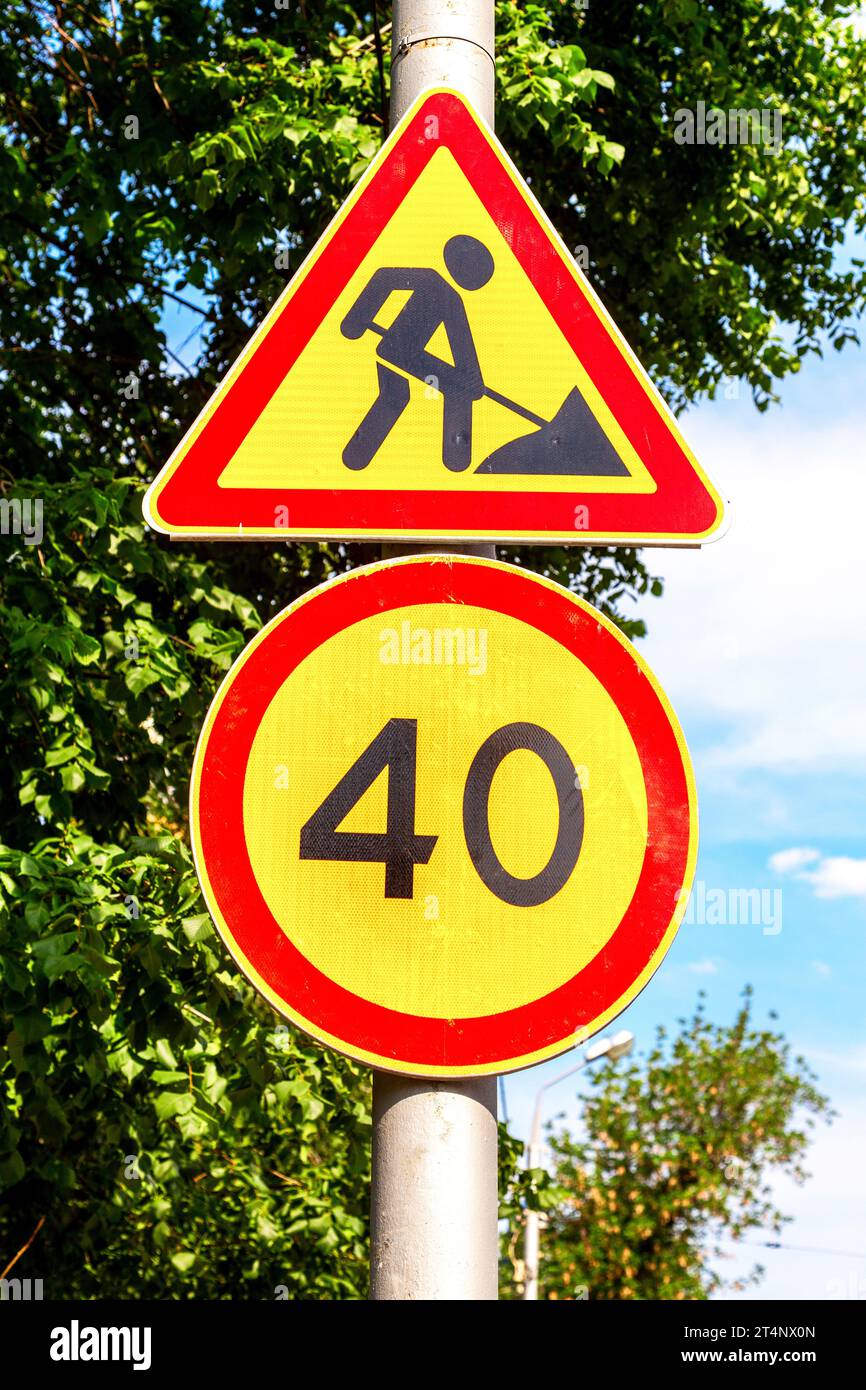 Road works sign at the city street. Carrying out construction and ...