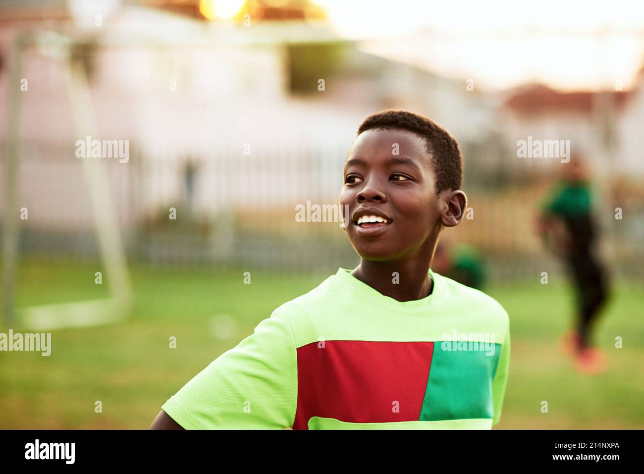 Playing a sport is a great way for kids to loosen up. a young boy ...