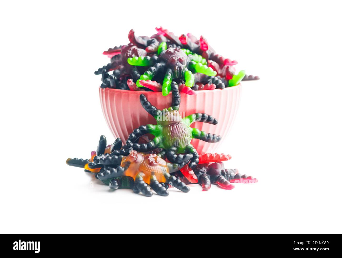 Scary sweet jelly spiders. Halloween candies in bowl isolated on white ...