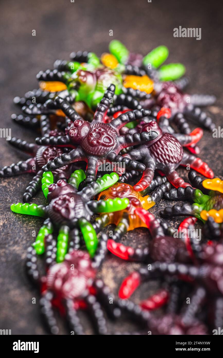 Scary sweet jelly spiders. Halloween candies on the black table Stock ...