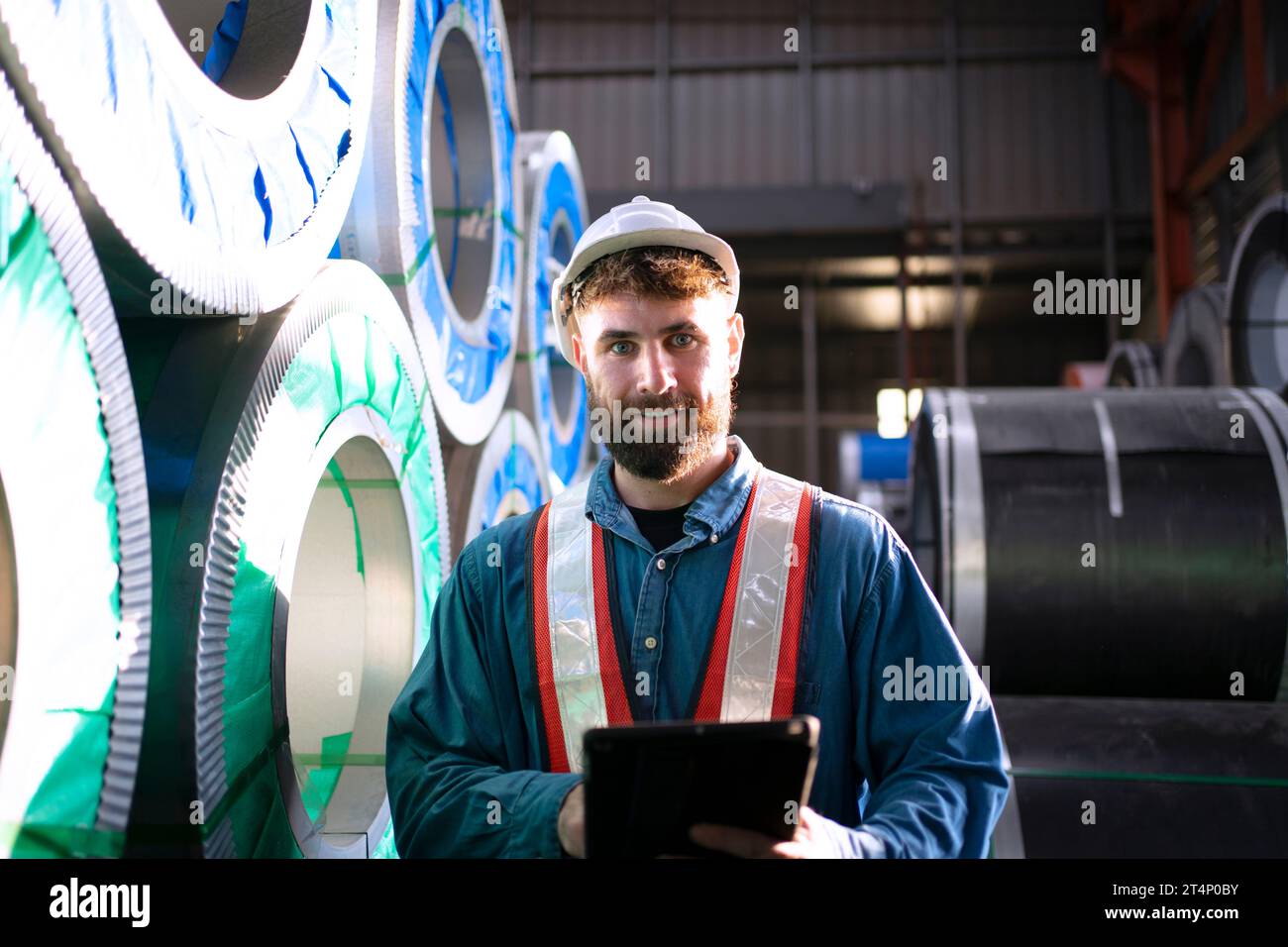 Blue collar worker work at metal sheet factory. Blue collar worker and ...