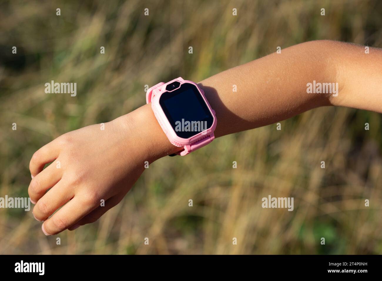 Close up smart watch on child's arm Stock Photo - Alamy