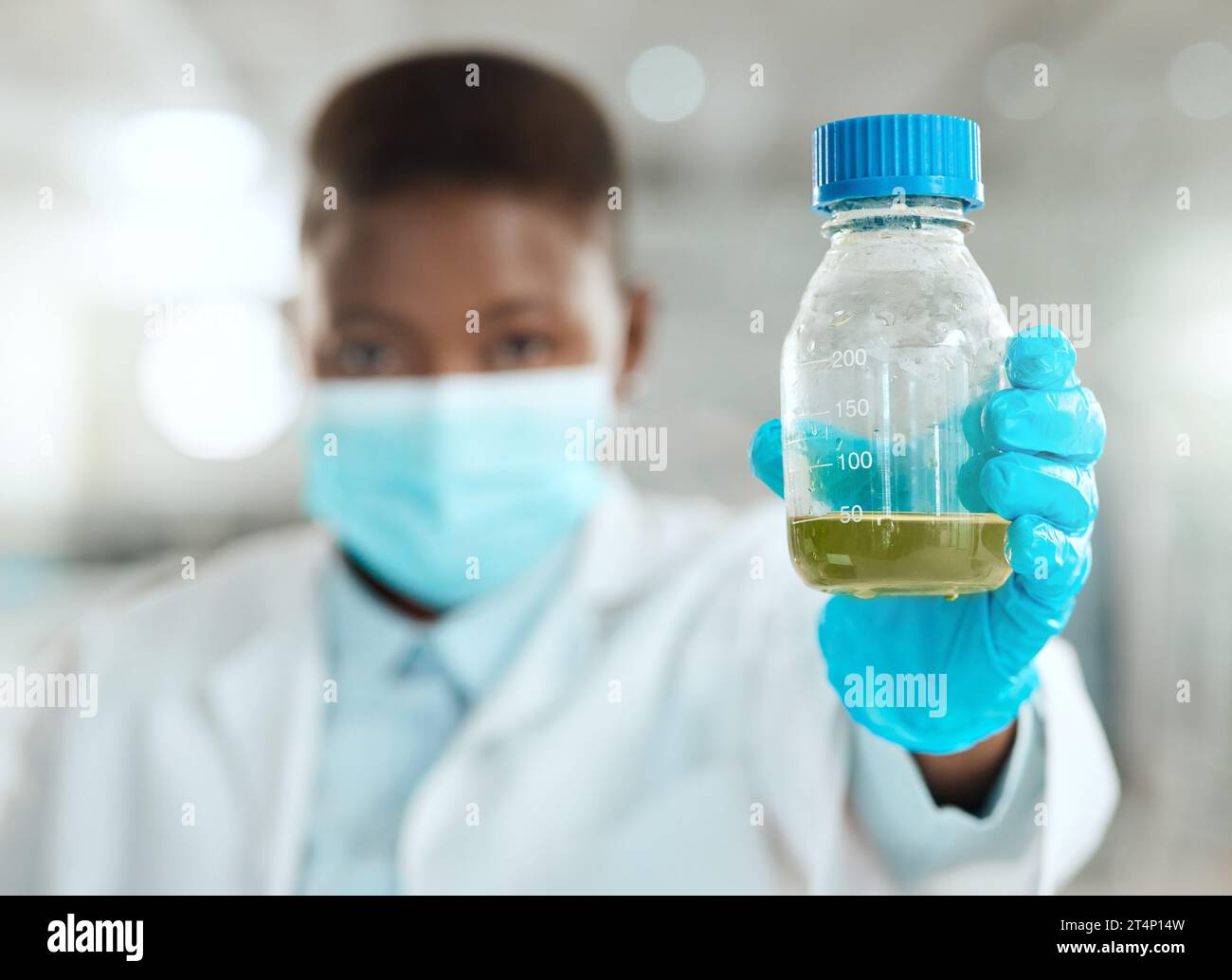 Im testing this today. an unrecognisable scientist holding a bottle of ...