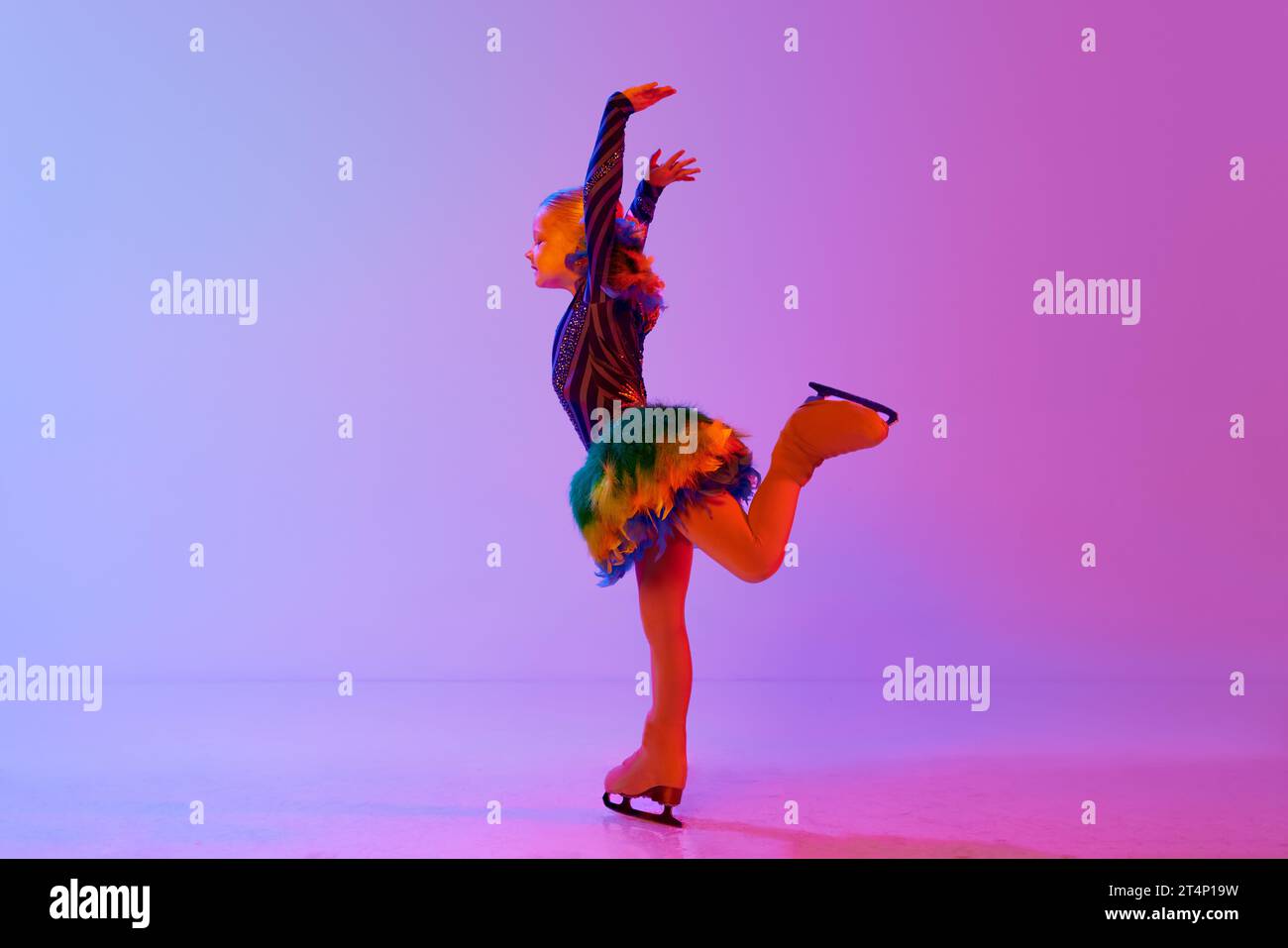 Cute, talented, little girl, child in stage costume dancing, skating on ...
