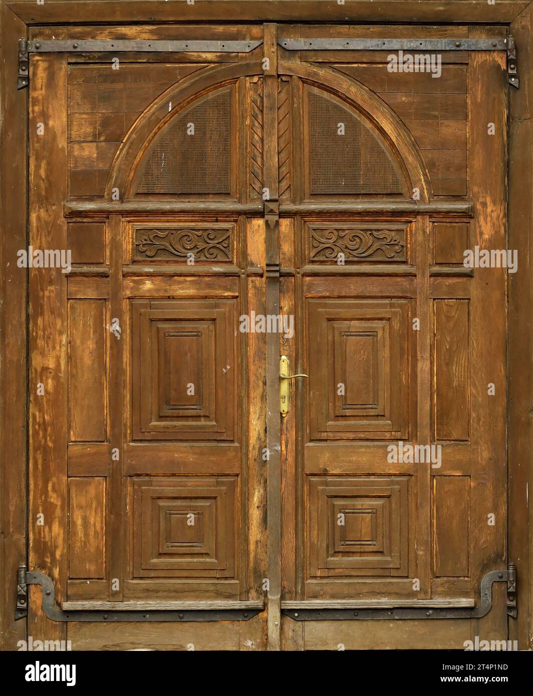 Very old solid wooden door in retro 19th century design close up ...