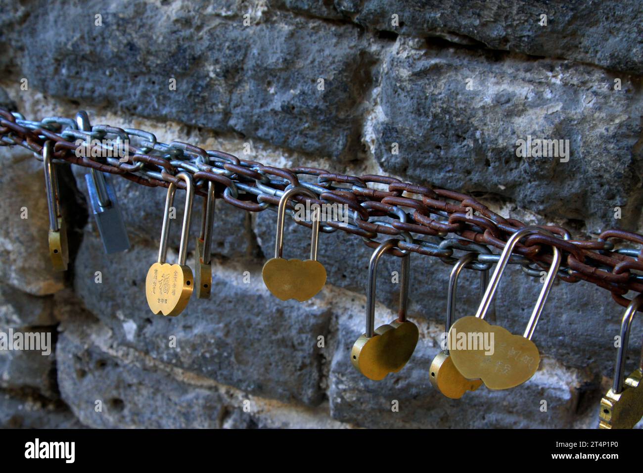 Copper lock in chains Stock Photo - Alamy