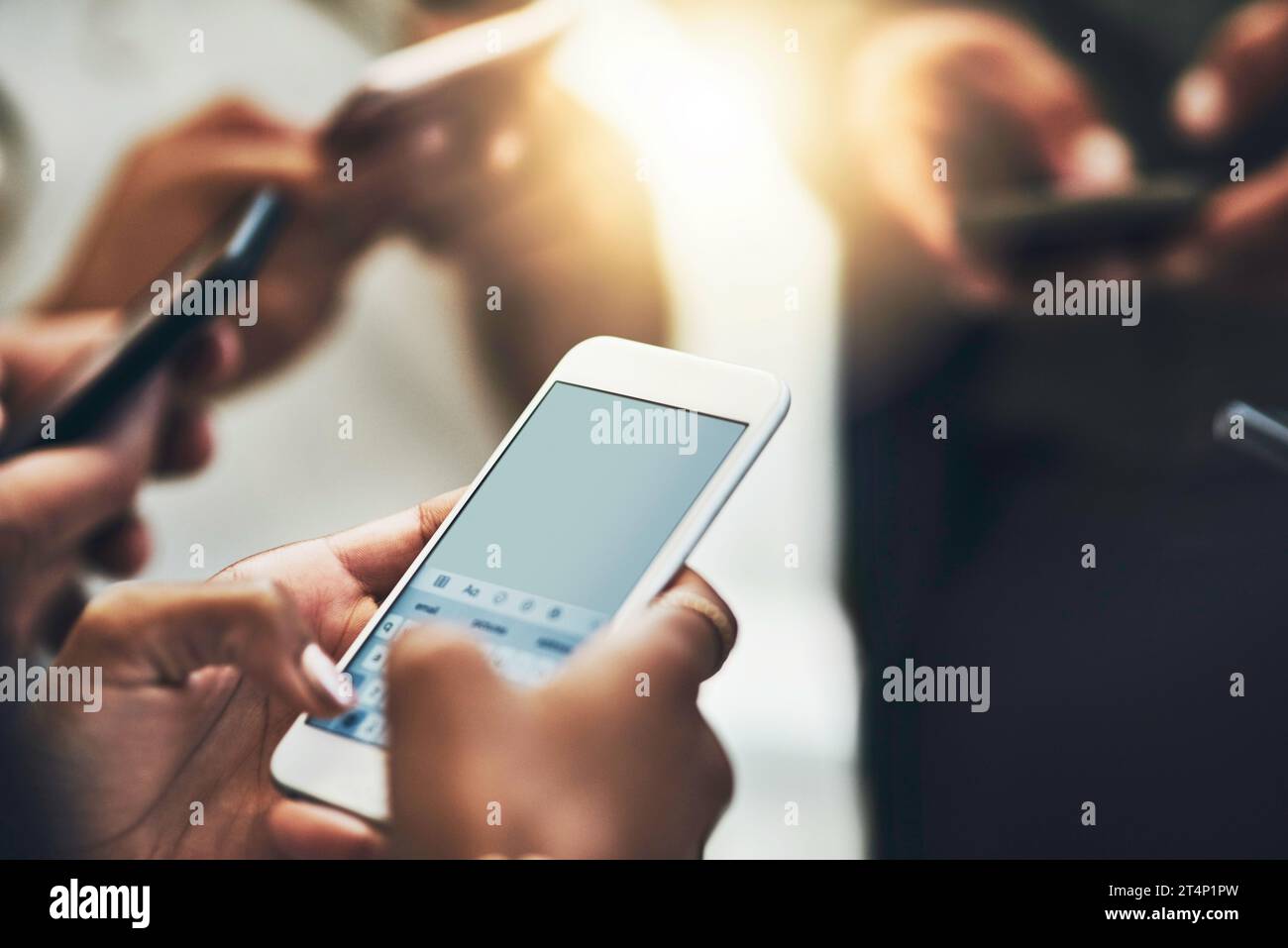 The age of communication. a group of unrecognizable businesspeople ...