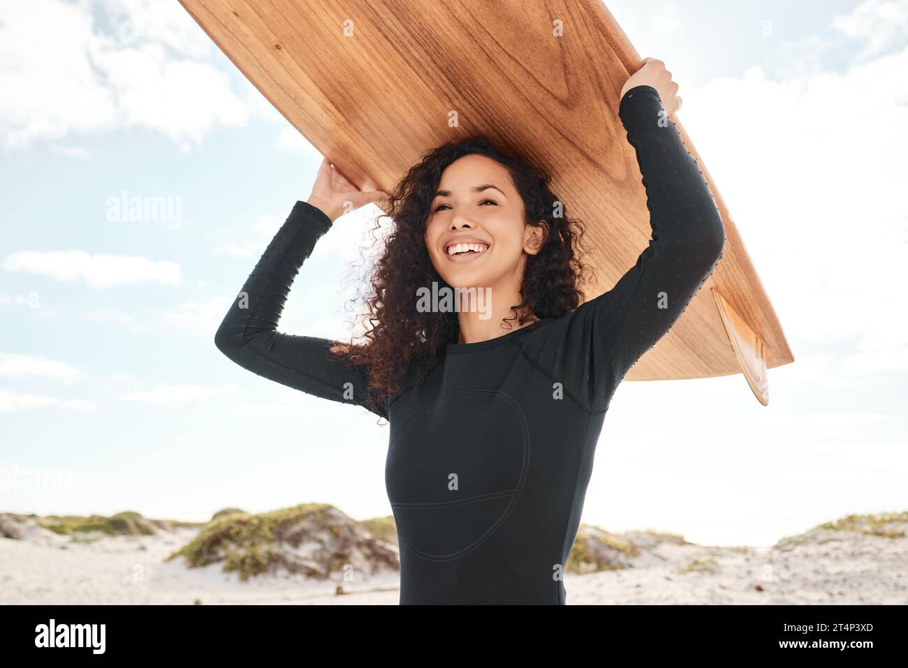 You can take a surfer out of the surf. an attractive young woman ...
