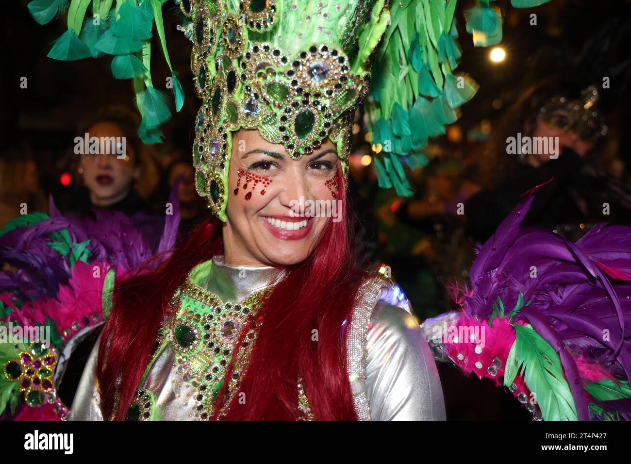 A woman part of a Samba groups entertains crowd during the New York’s ...