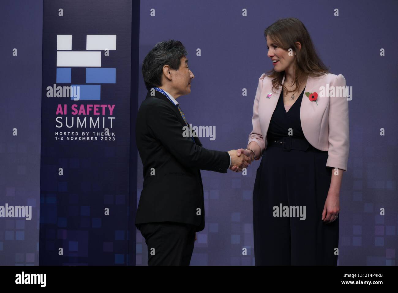 Technology Secretary Michelle Donelan greets Yoichi Iida, Assistant ...