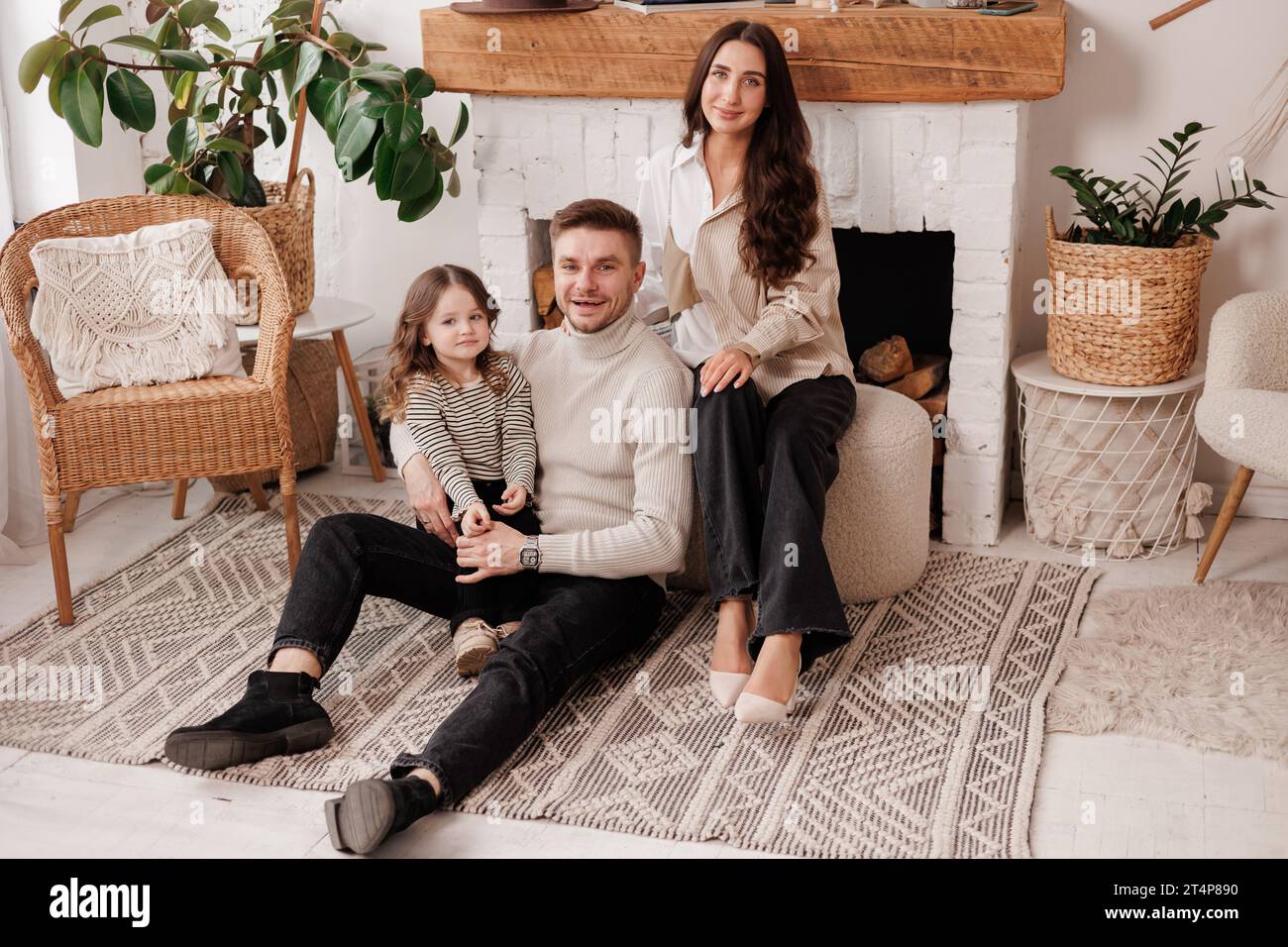 Happy family day. Young loving parents, mom and dad tickle adorable ...