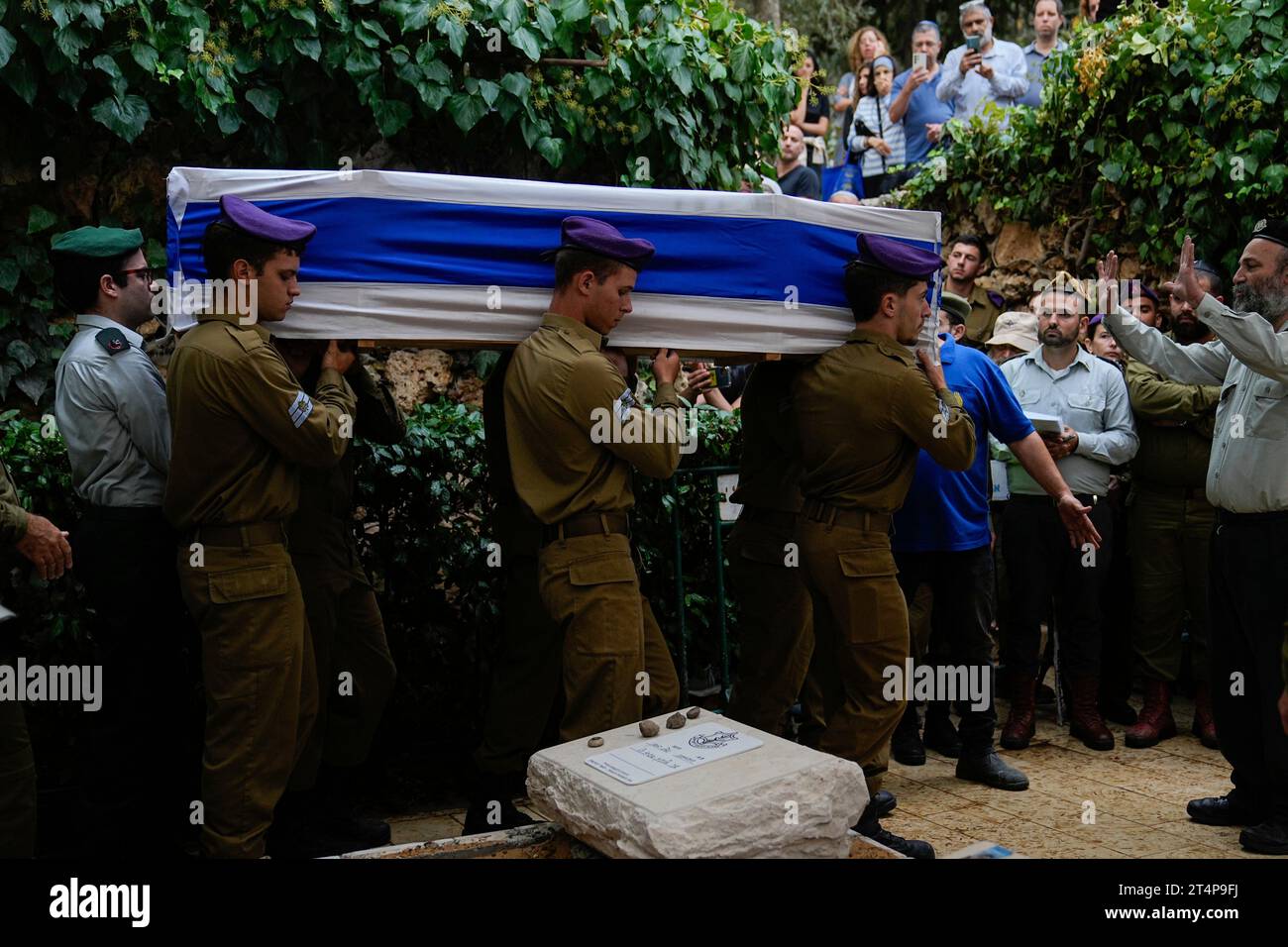 Israeli soldiers carry the flag-draped casket of Staff Sgt. Lavi ...
