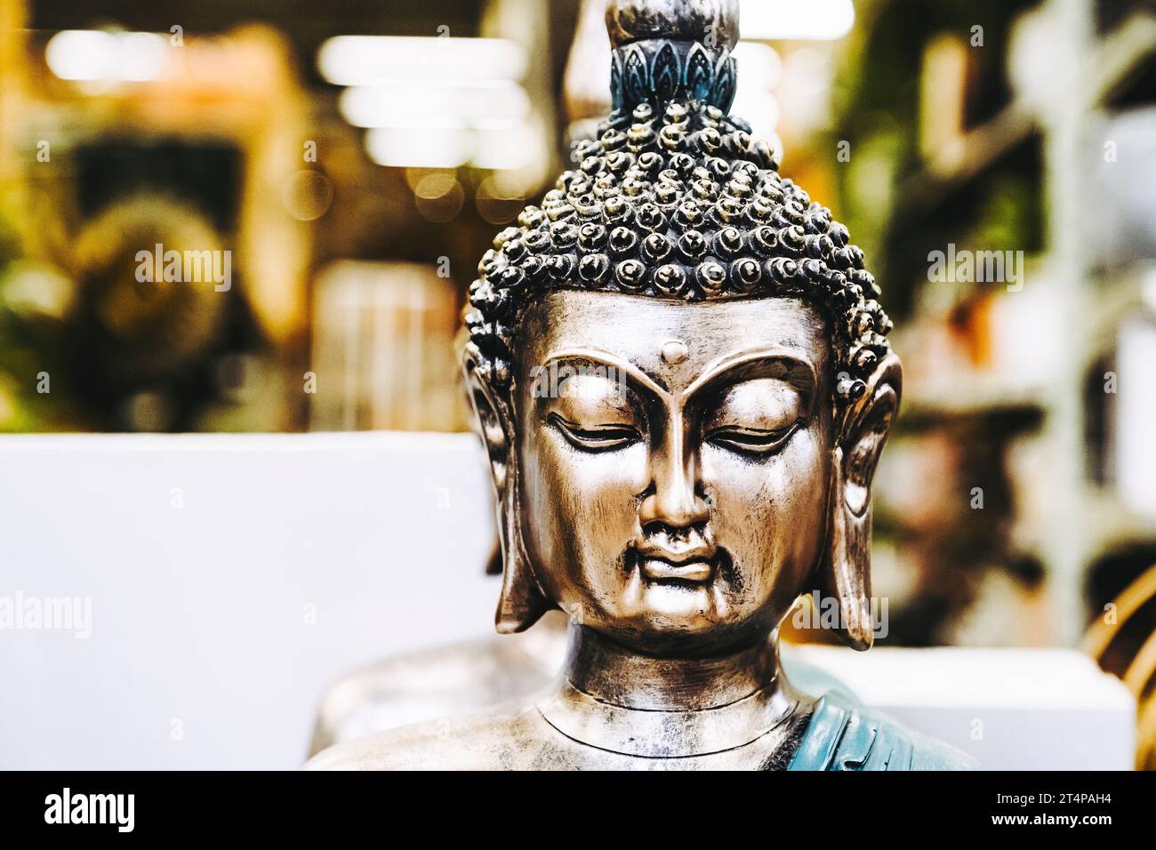 Bronze Buddha face statue - Symbol of peace and serenity Stock Photo ...