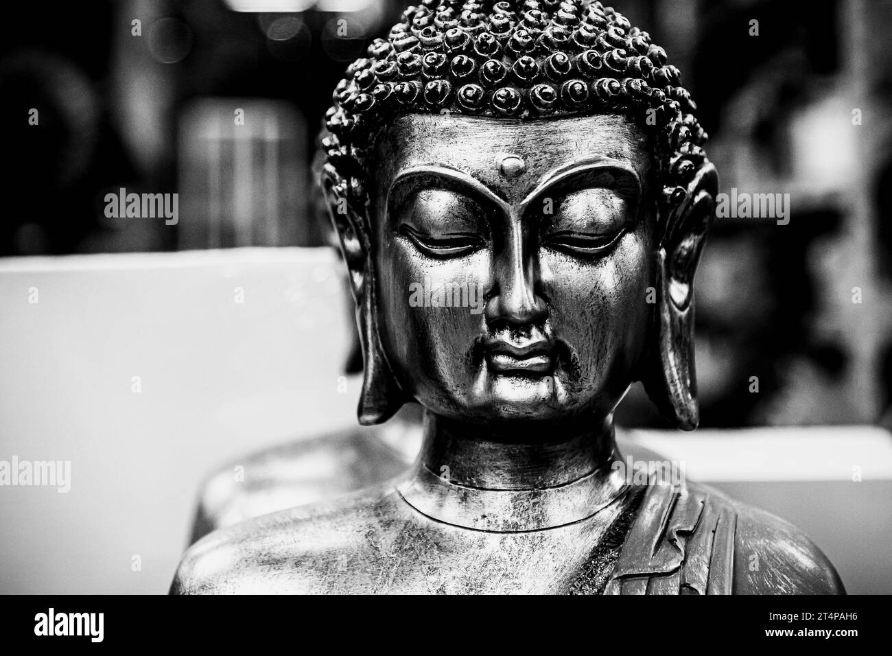 Bronze Buddha face statue - Symbol of peace and serenity Stock Photo ...