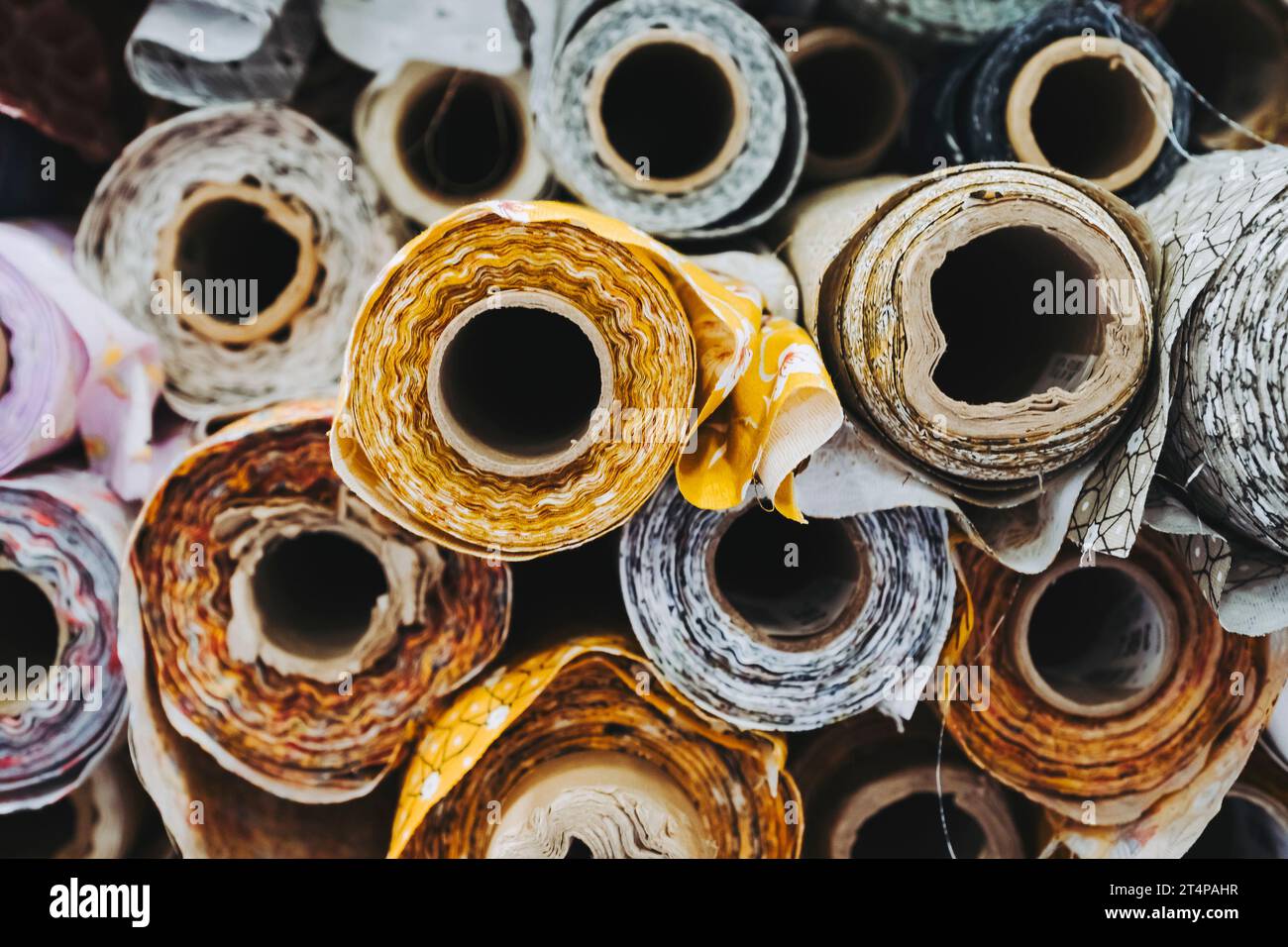 Rolls of fabric with colorful patterns - Sewing equipment Stock Photo ...