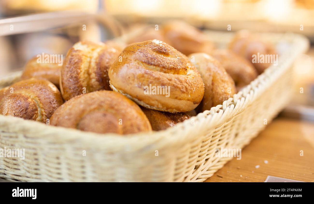 Delicious fresh butter buns in baskets in bakery Stock Photo - Alamy