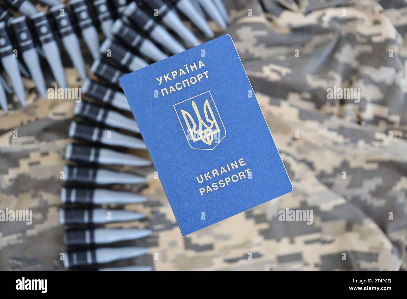 Ukrainian foreign passport on fabric with texture of military pixeled ...