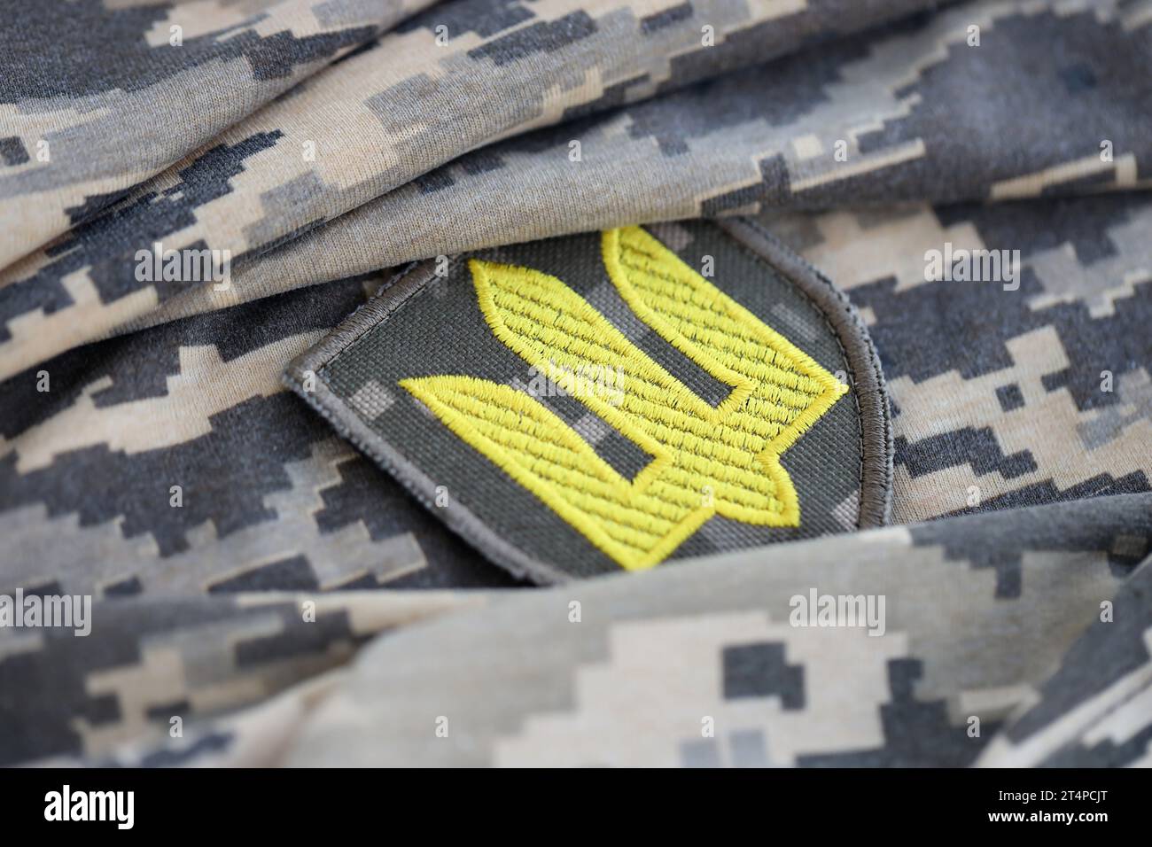 Symbol of Ukrainian army on the camouflage uniform of a Ukrainian ...