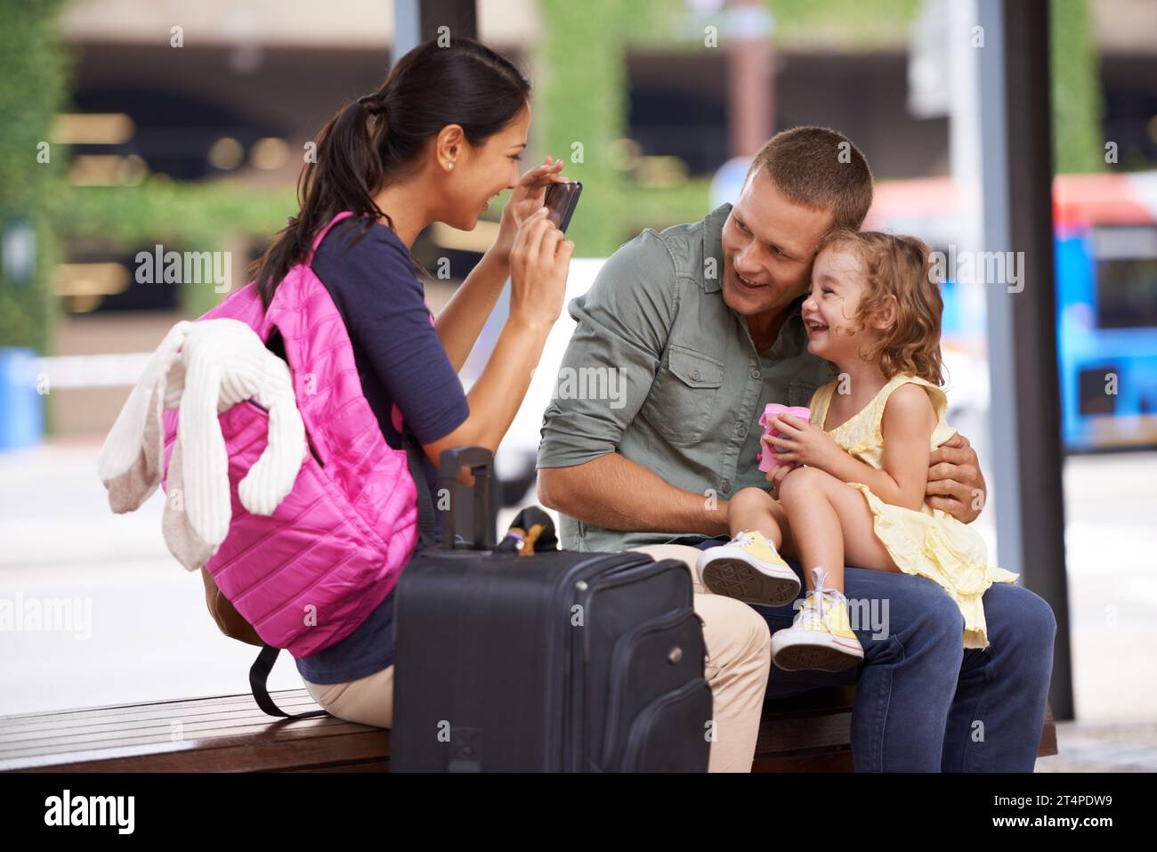 Daddys girl and mommys world. A family taking pictures at the beginning ...