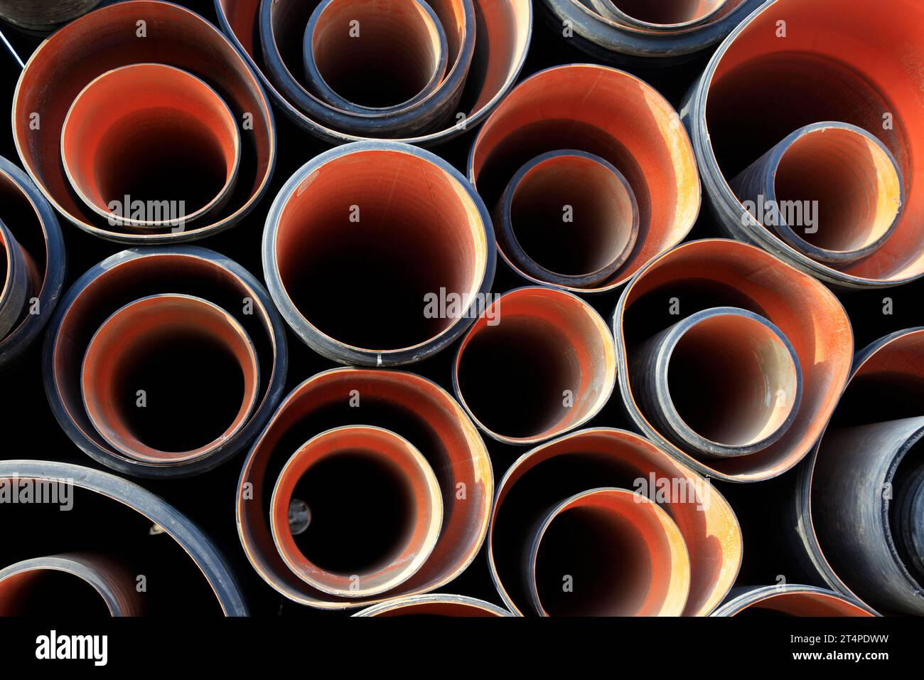 Plastic pipe pile up together, closeup of photo Stock Photo - Alamy