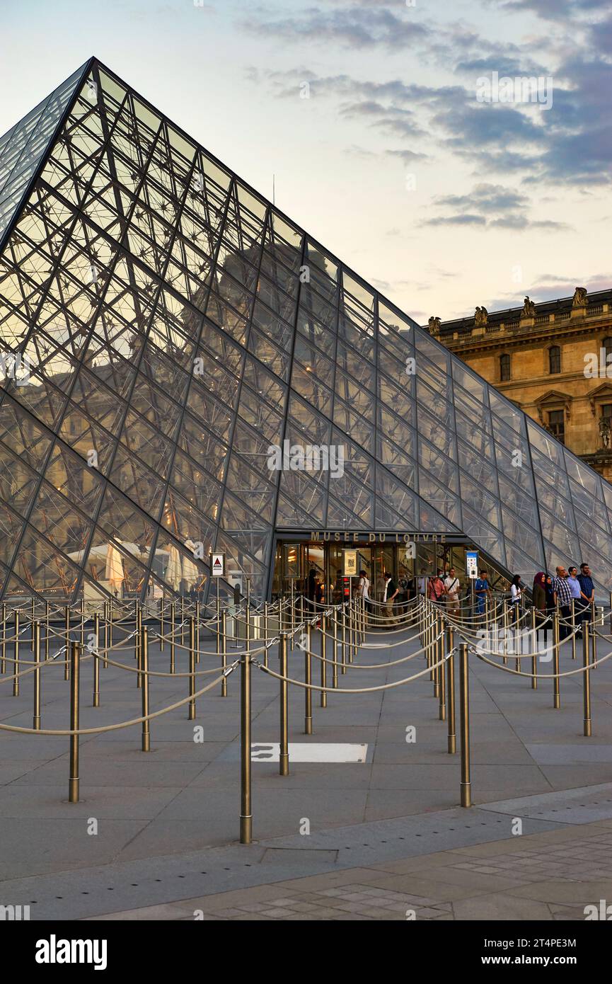 View on the glass pyramids of Louvre palace at sunset Stock Photo - Alamy