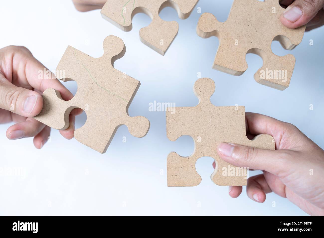 Unity joining hands hi-res stock photography and images - Alamy
