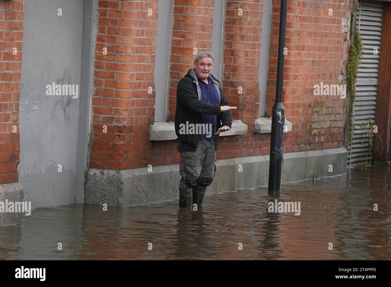 A man gestures about the levels of flood water in Newry Town, Co Down ...