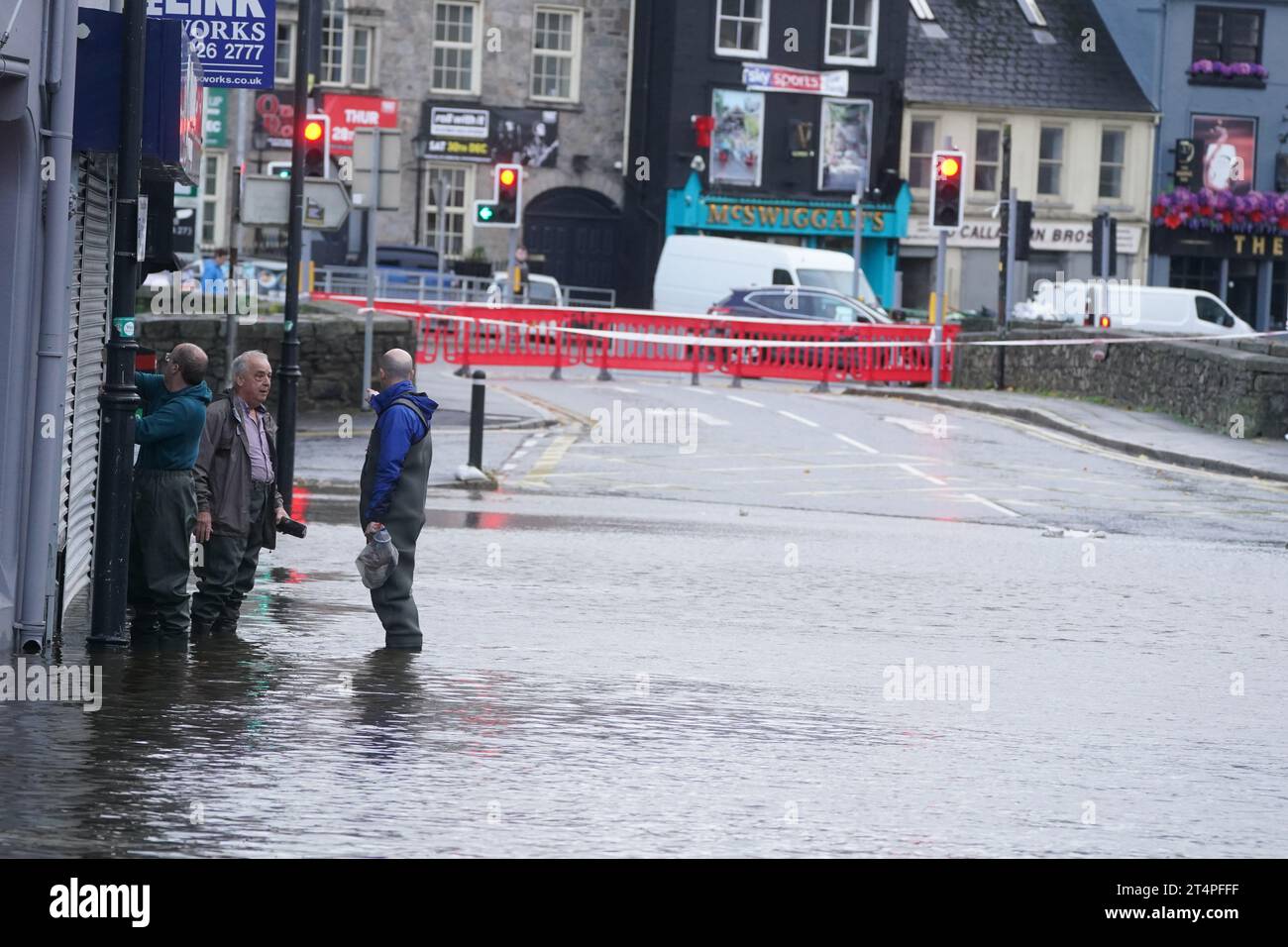 People walk through flood water in Sugar Island, Newry Town, Co Down ...