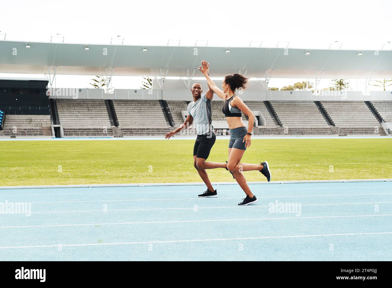 Yes We finished. Full length shot of two young athletes giving each ...