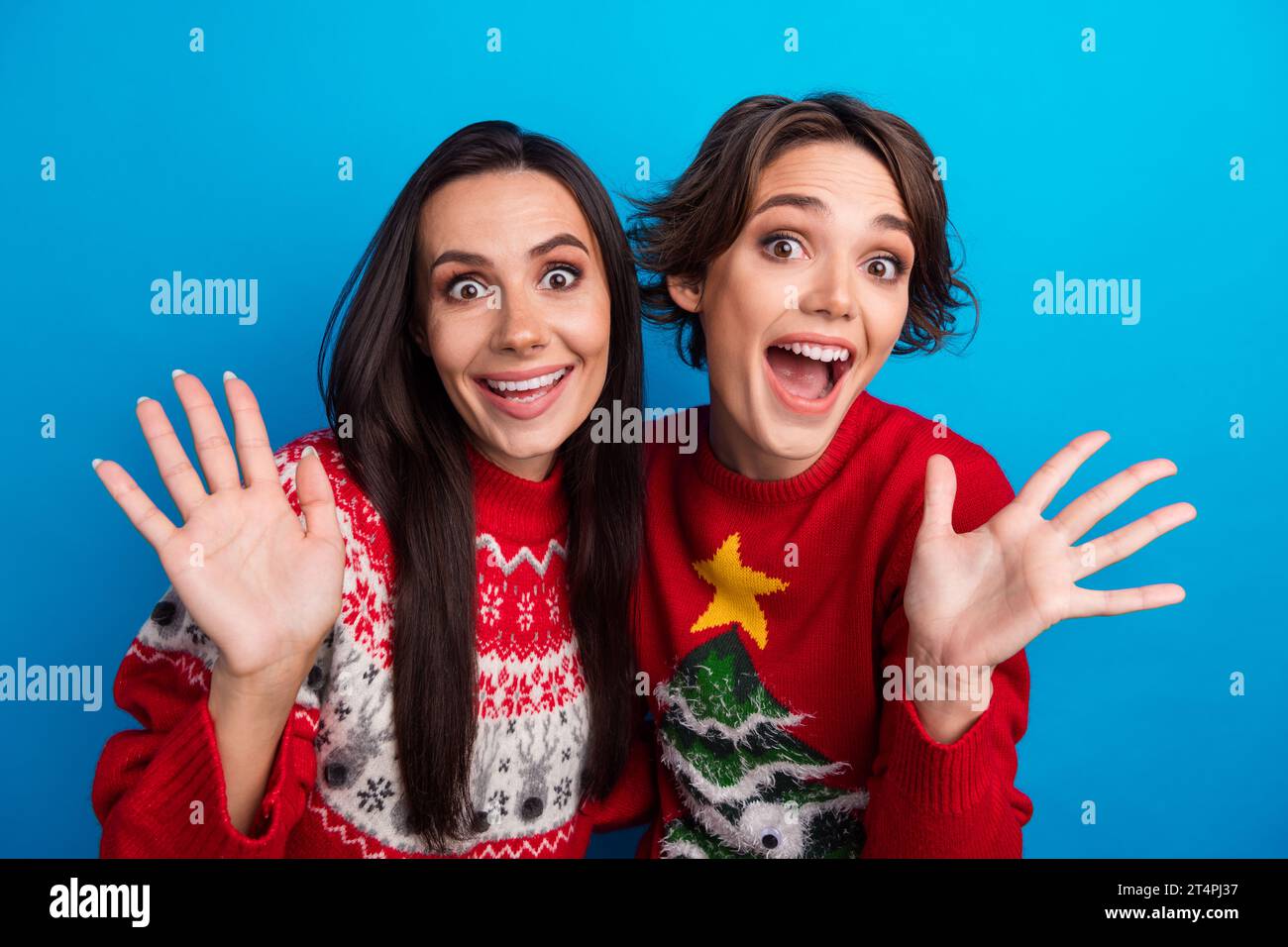 Photo of excited girls waving hands video call friends on christmas eve ...