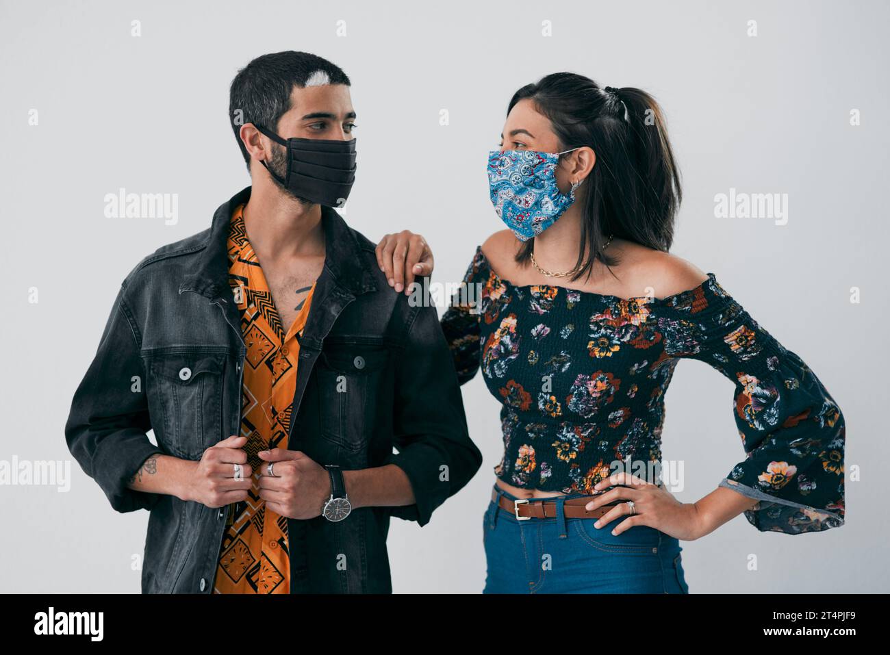 Face masks just upped our fashion game. Studio shot of a masked young ...