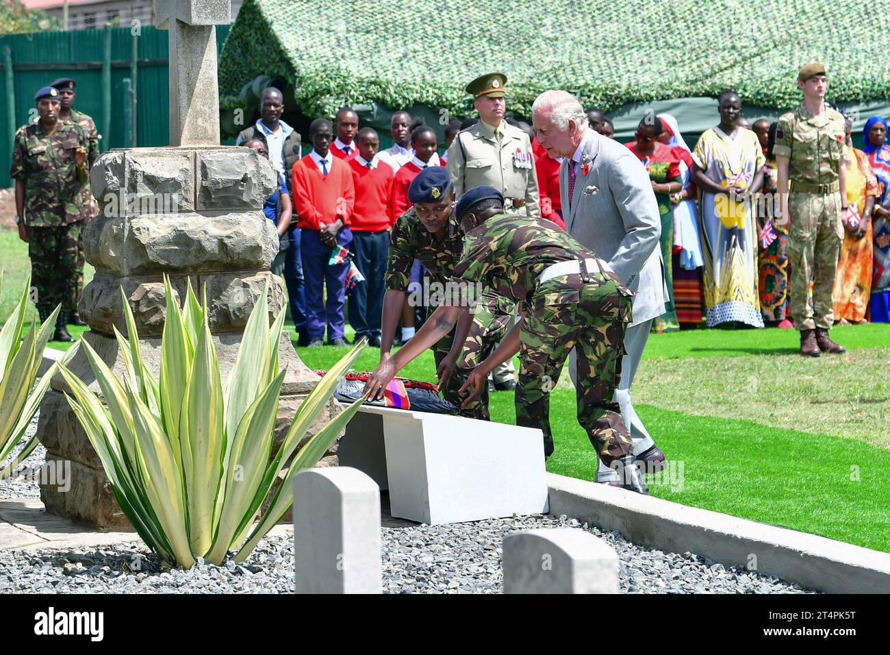 Britain's King Charles III lays a wreath, during a visit to Kariokor ...