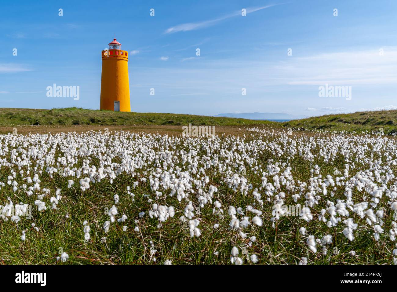 Holmsberg Lighthouse, an orange light house on the Reykjanes Peninsula ...