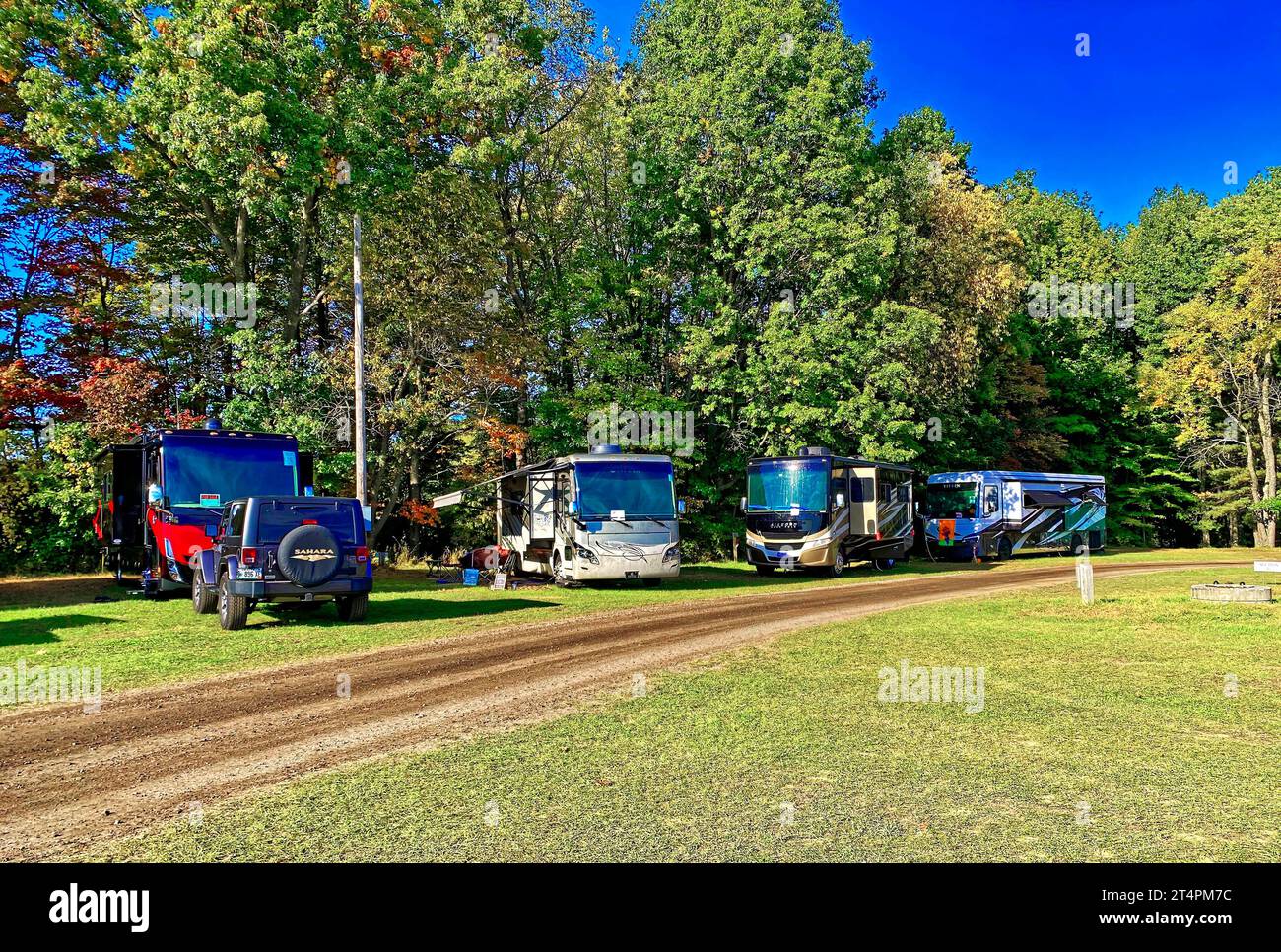 four class A motorhomes, parked on grass, RV rally, gathering ...