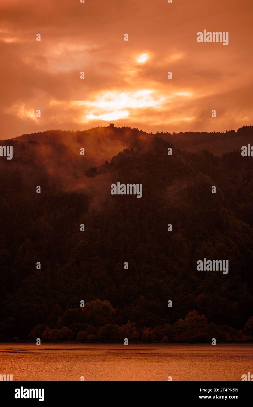 Mysterious landscape with fog and trees on crater rim, Furnas, Azores ...