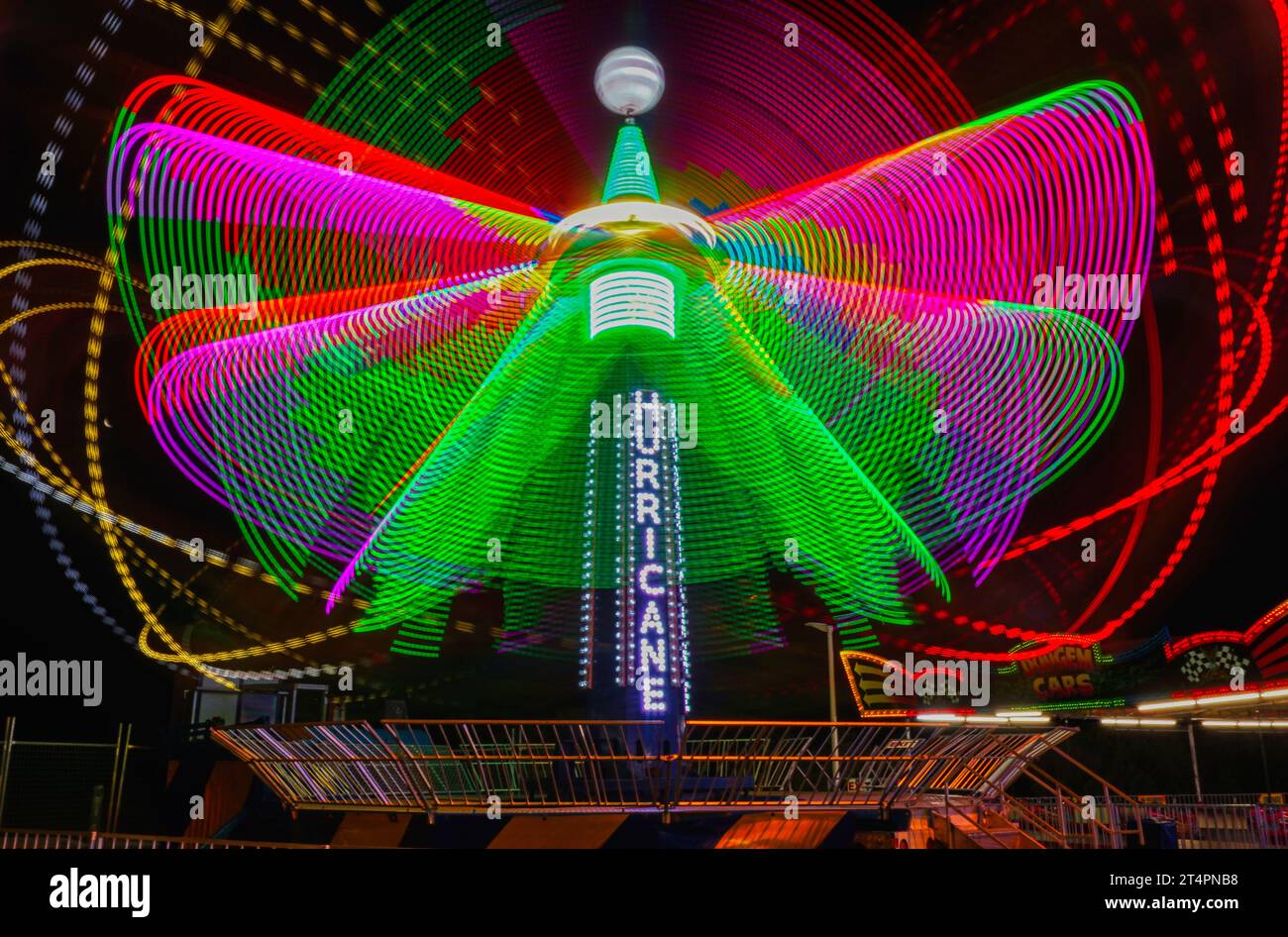 a timelapse photo of a sideshow hurricane ride Stock Photo - Alamy