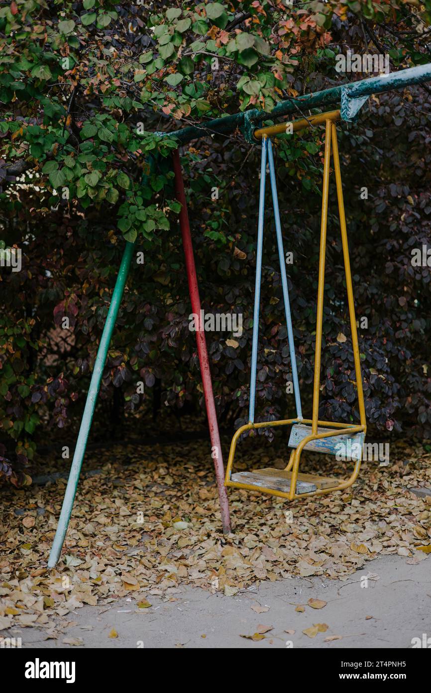 Children's swing for one person. Retro playground. Yard equipment in ...