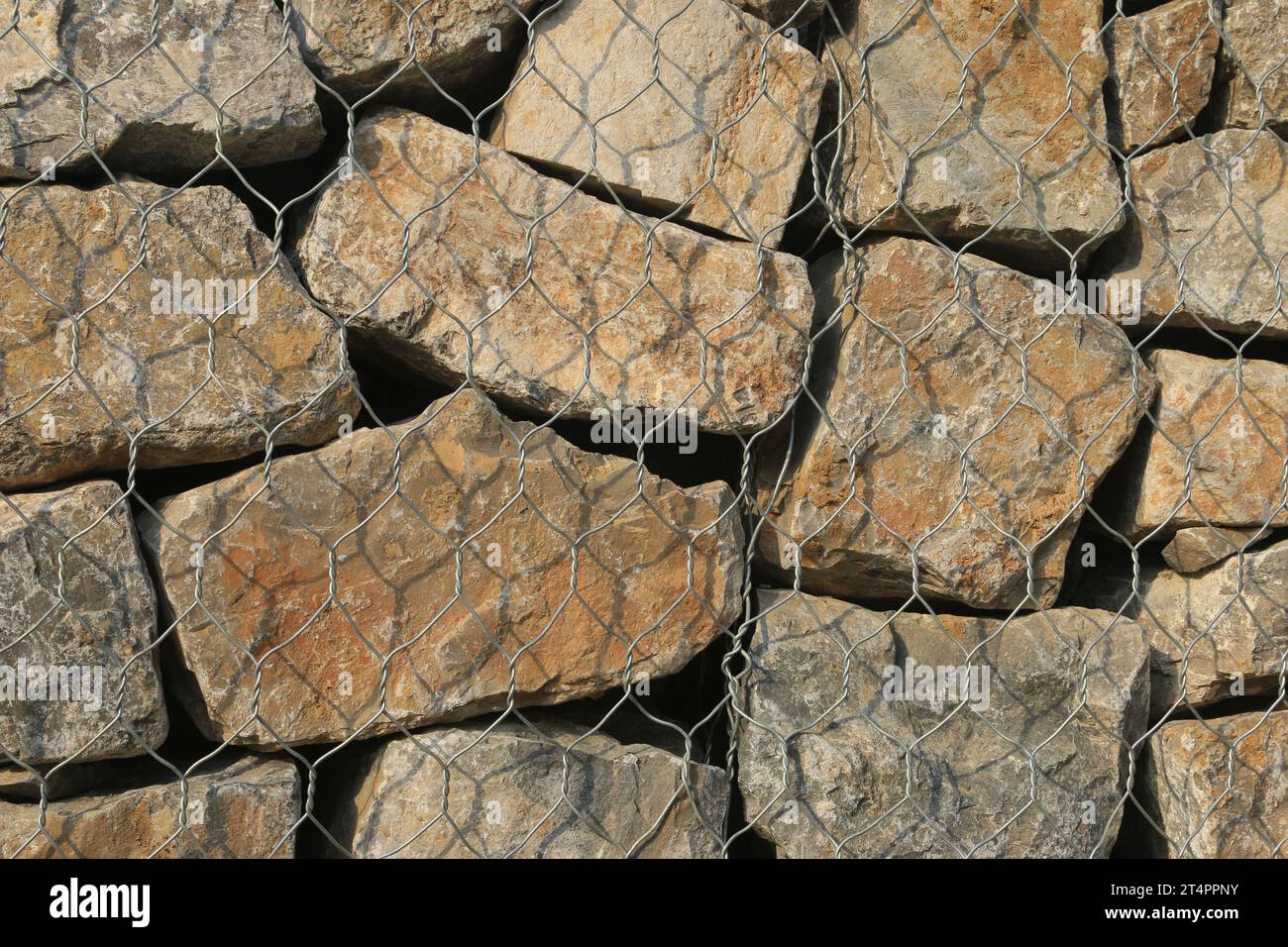 Rock and barbed wire Stock Photo - Alamy