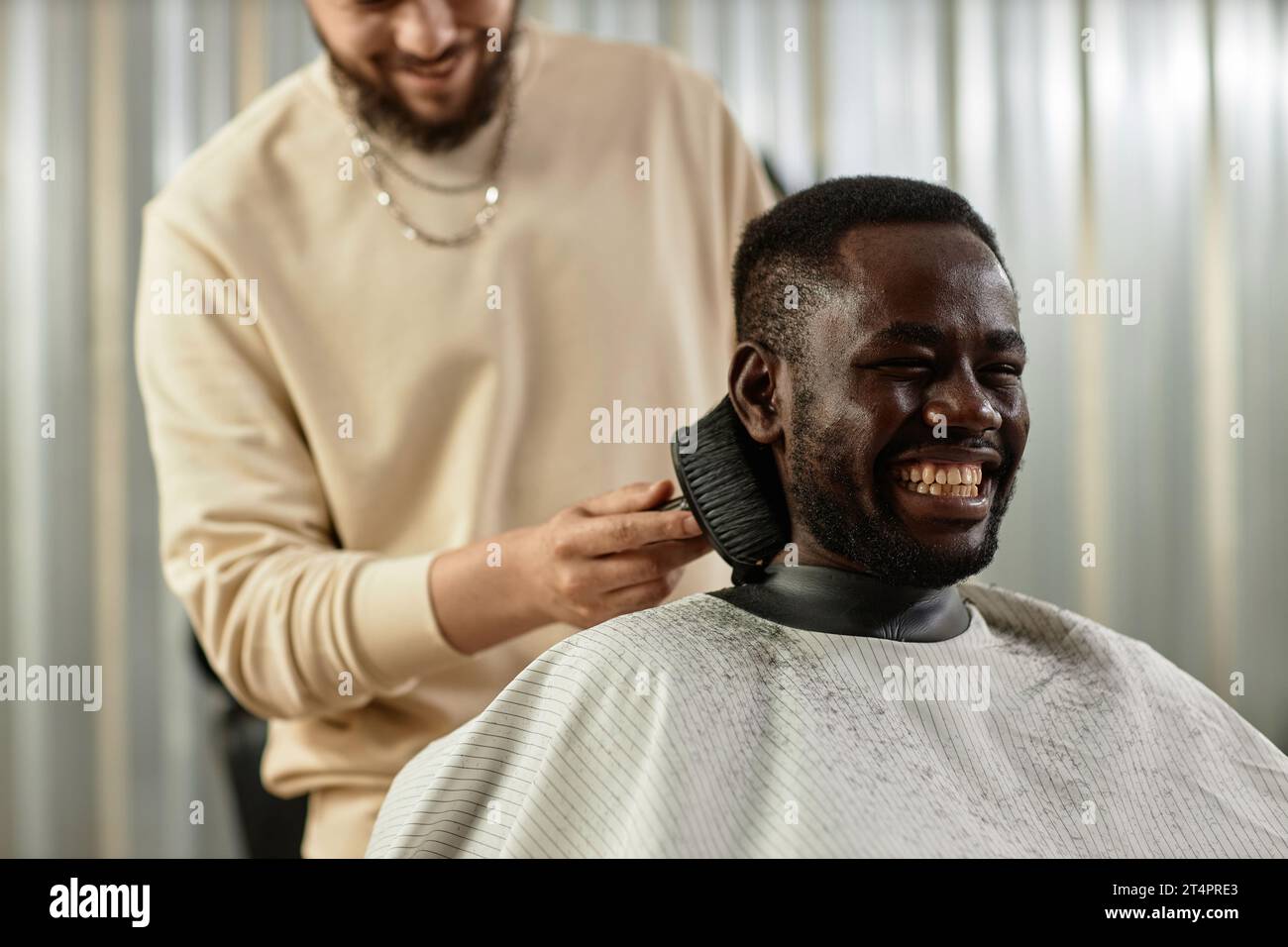 Barbershop customer sitting on chair hi-res stock photography and ...