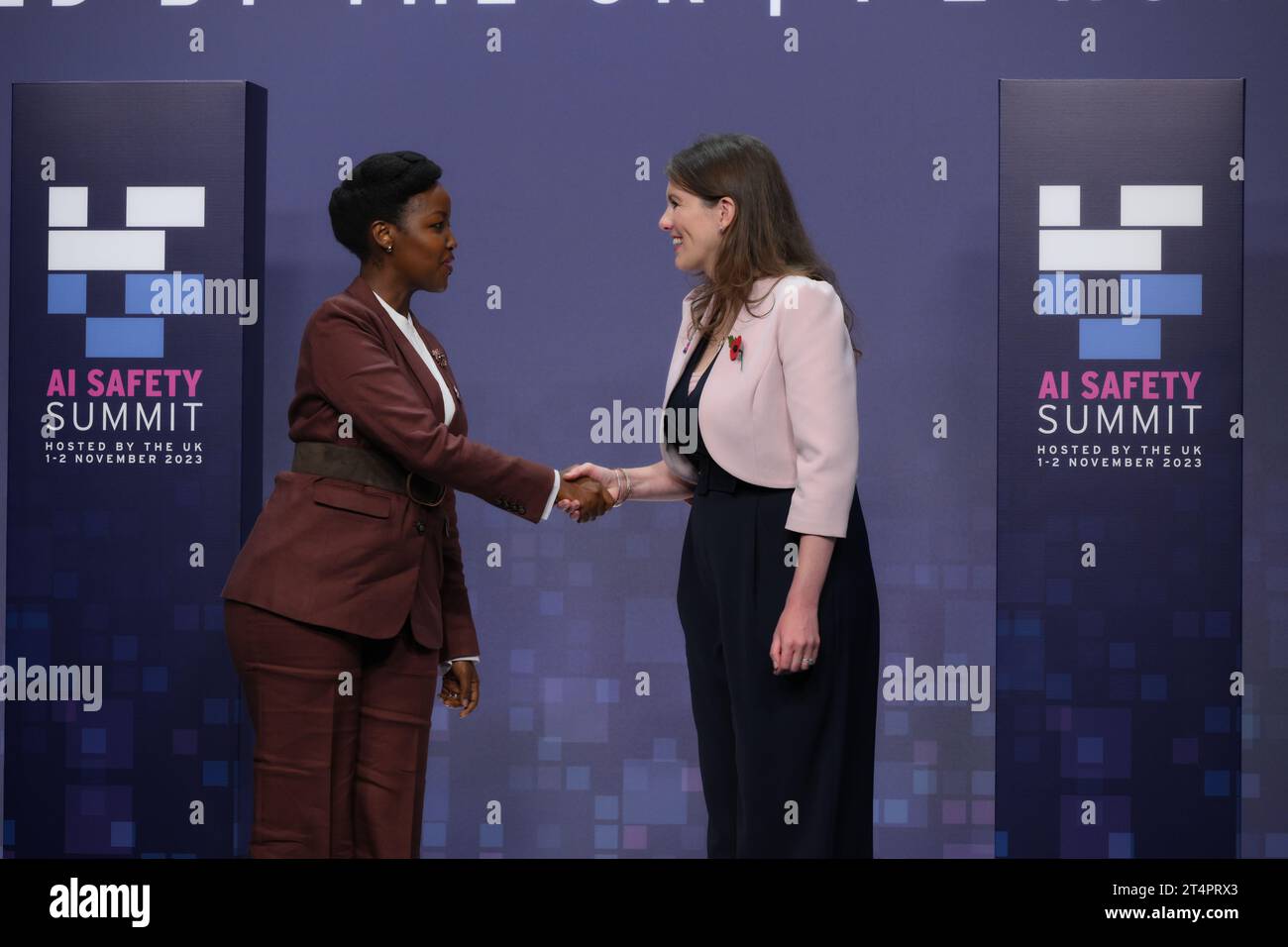 Technology Secretary Michelle Donelan greets Paula Ingabire, Minister ...