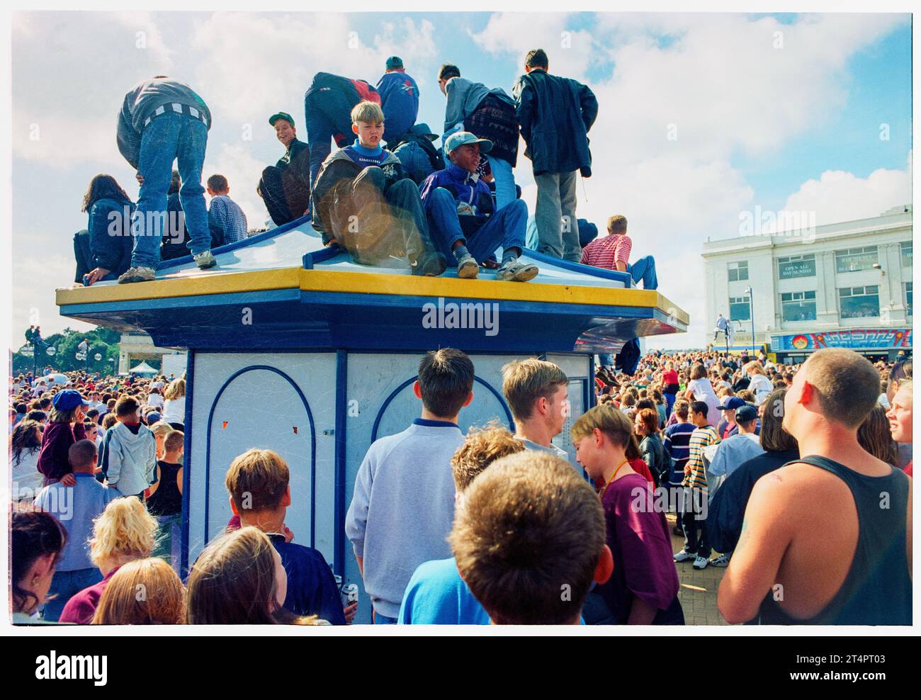 POP FANS, BARRY ISLAND, 1996: A huge crowd gathers on the beachfront ...