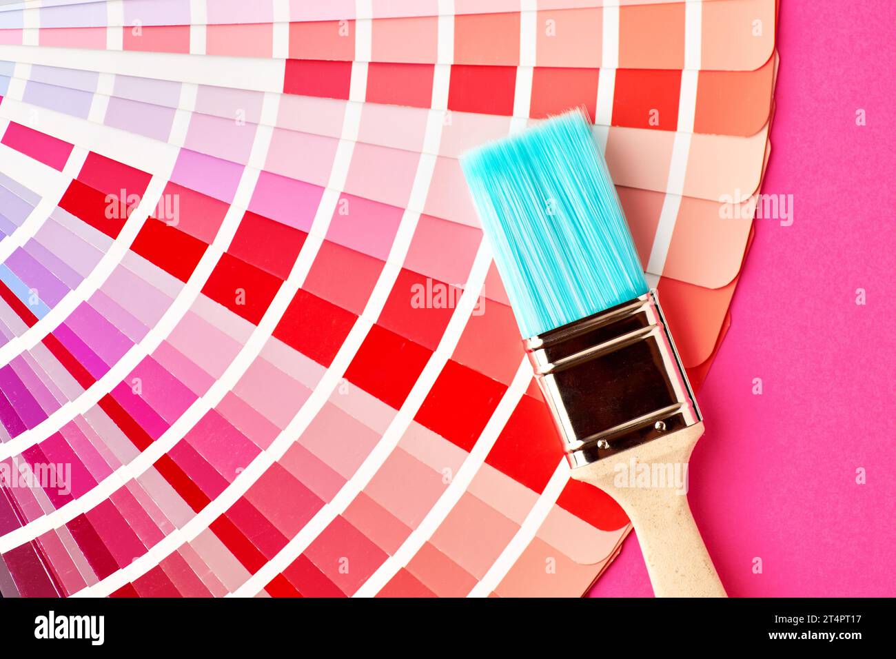 Close-up of color swatches book and painting brush. Diverse colors ...
