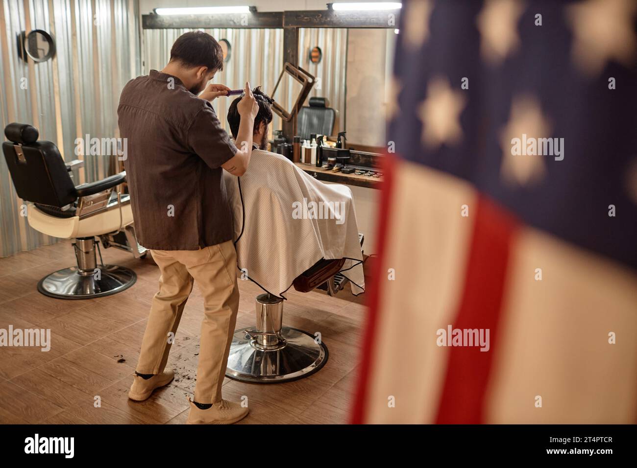 Hairdresser making haircut young man hi-res stock photography and ...