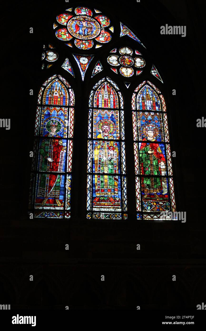 Stained glass windows of towering Gothic church Stock Photo - Alamy