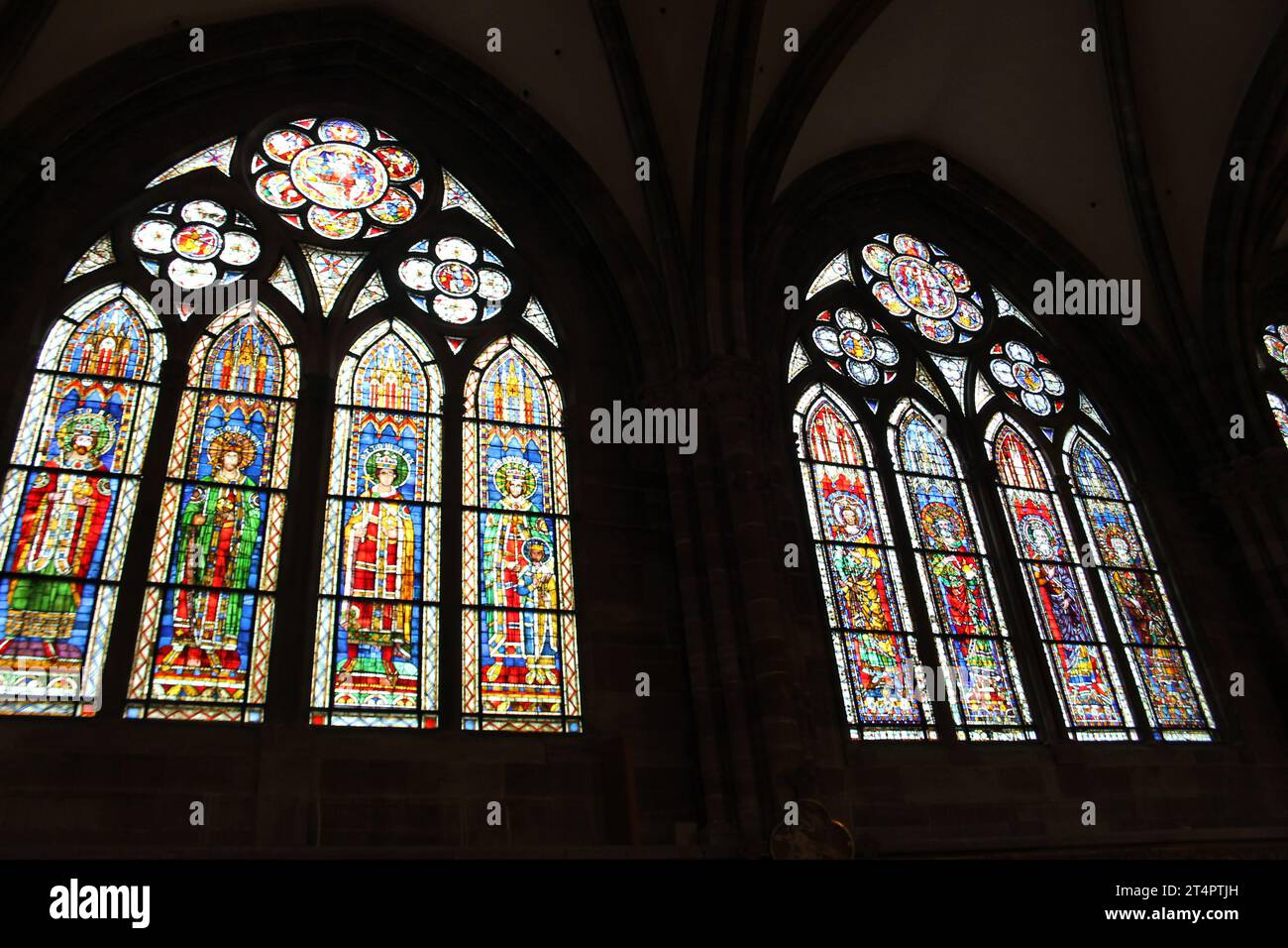 Stained glass windows of towering Gothic church Stock Photo - Alamy