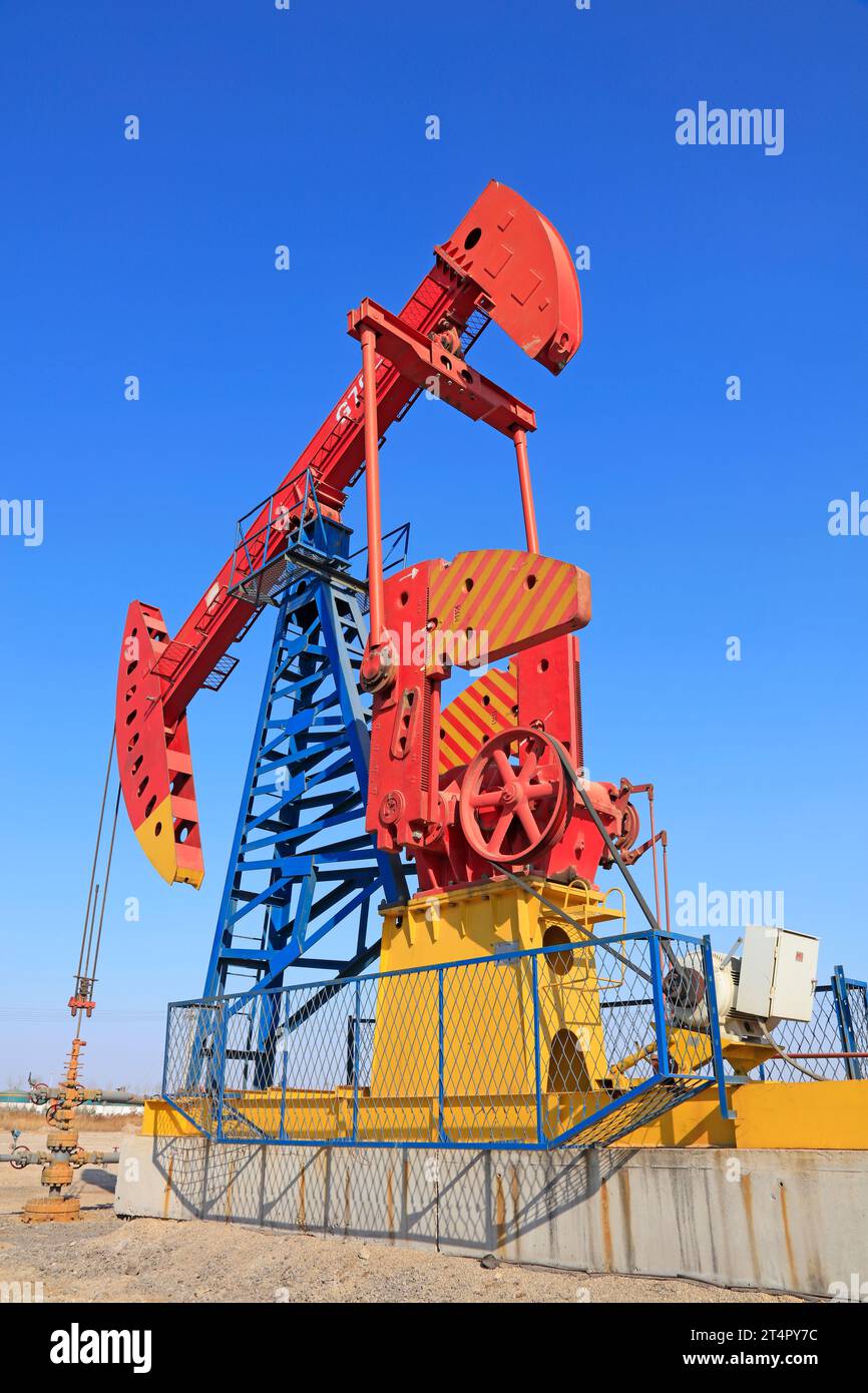 pumping unit under blue sky in oilfield Stock Photo - Alamy