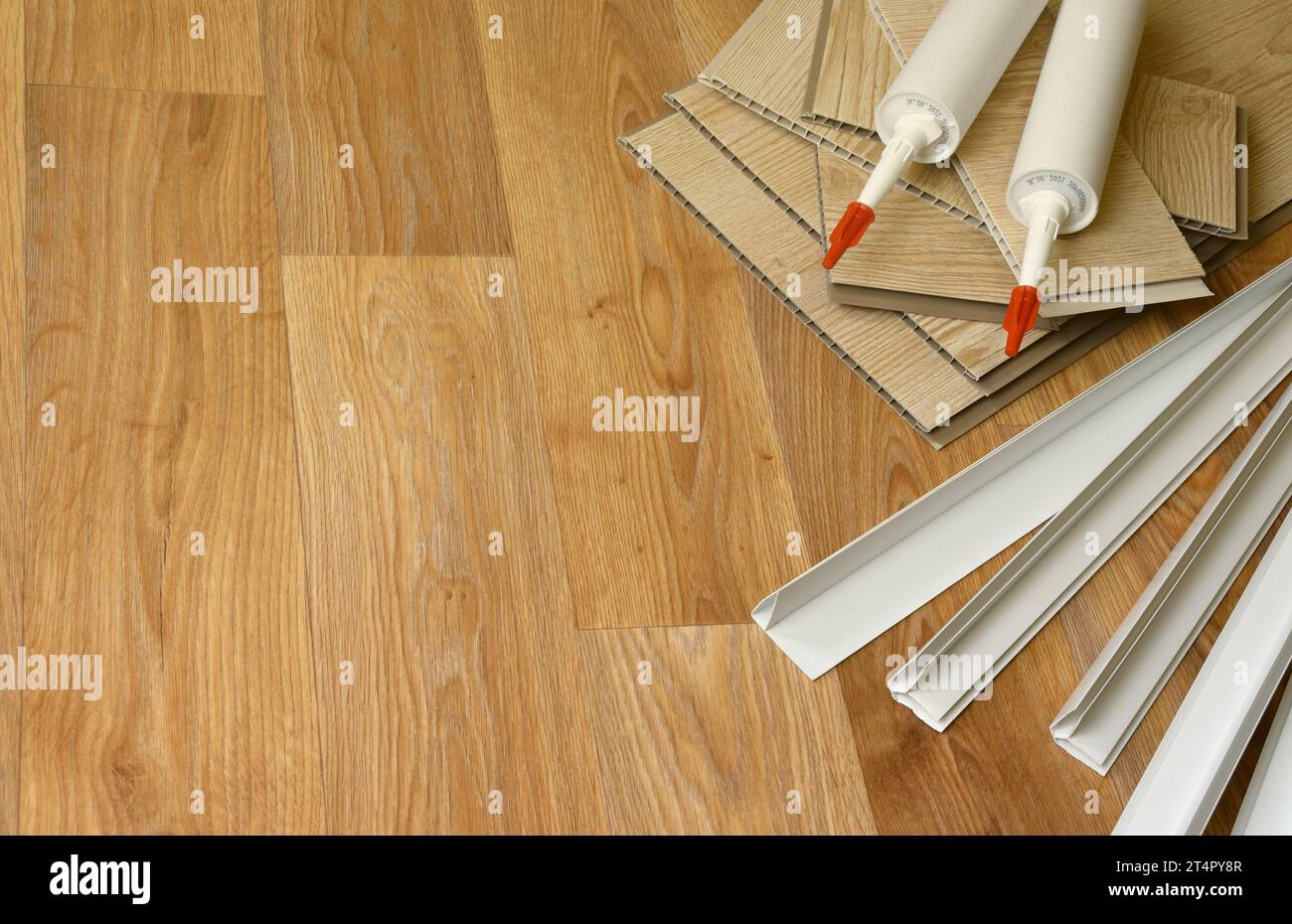 Set of items for PVC ceiling indoor works. Assembly adhesive bottles ...